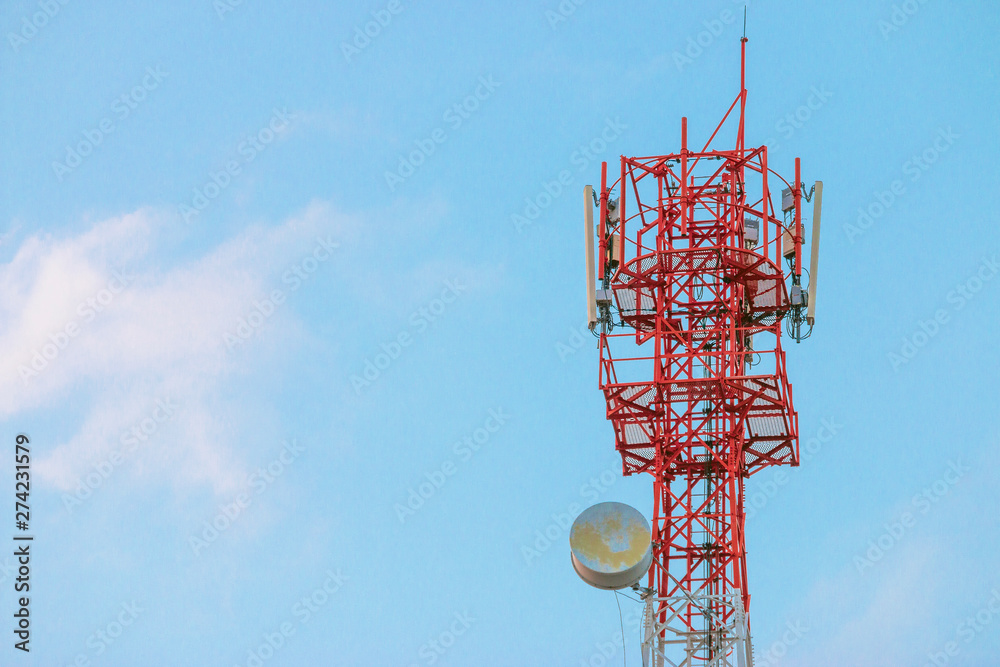 Wireless Communication Antenna Transmitter. Telecommunication tower with antennas on blue sky ...