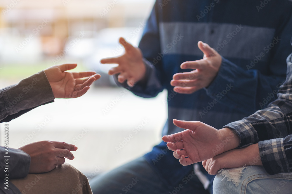 People sitting and talking together Stock Photo | Adobe Stock