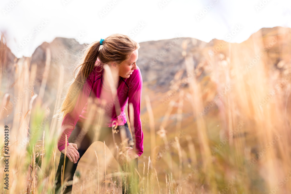 Gold King Basin, near Telluride, Colorado, USA: A female runner running ...