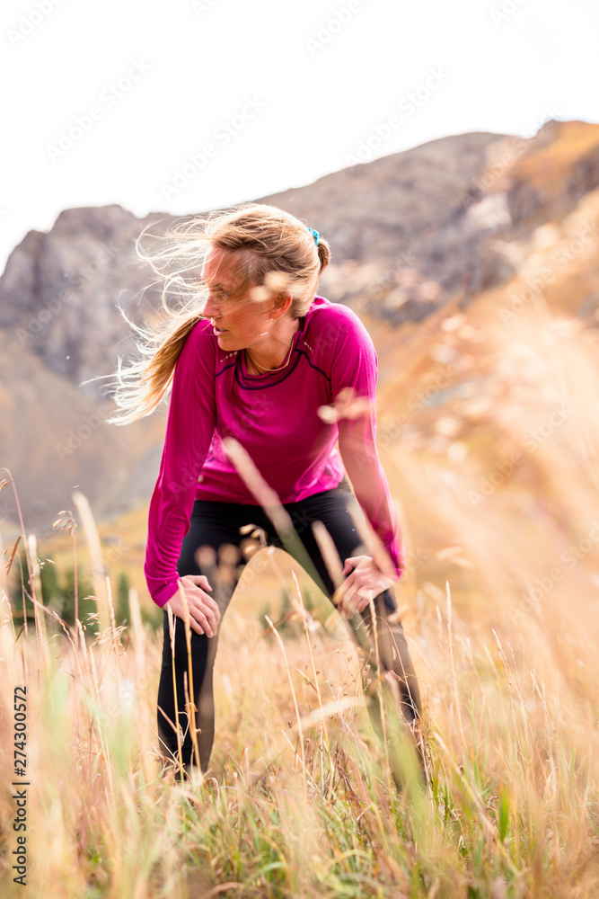 Gold King Basin, near Telluride, Colorado, USA: A female runner running ...