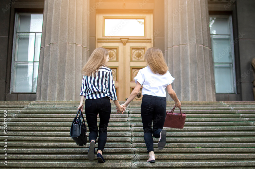 female students go to school, they go upstairs to the university ...