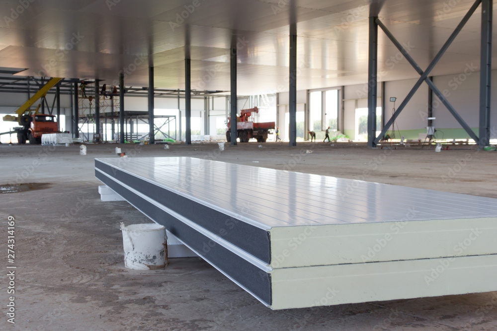 Sandwich panels at the construction site. Material for warming the ...