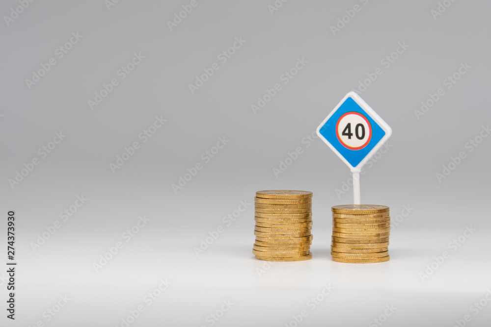 Two stacked coins and copper coins and digital signs reflect currency ...