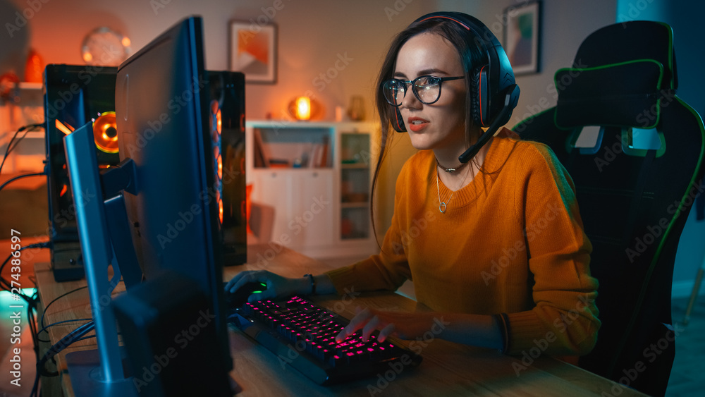 Excited Gamer Girl in Headset with a Mic Playing Online Video Game on ...
