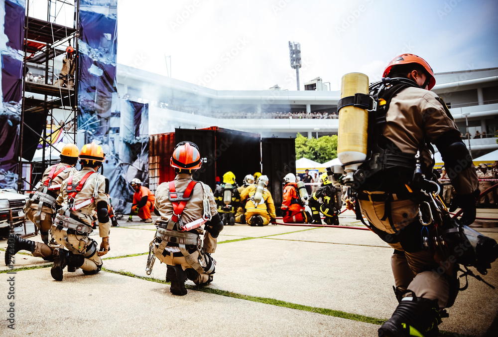 The Back side view of a group of teamwork .firefighters helped stop the ...