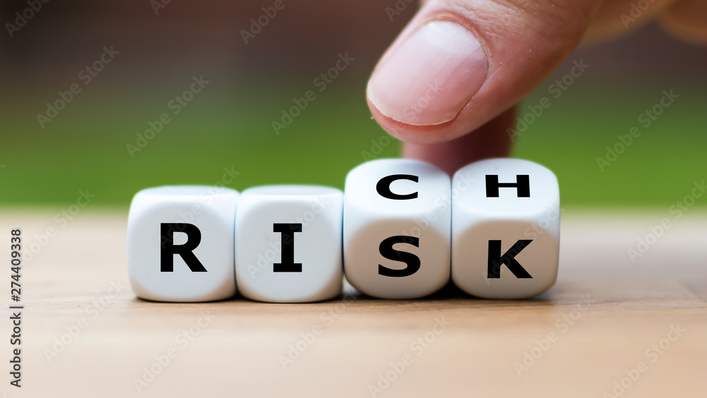 Take a risk and getting rich concept. Hand turns dice and changes the ...