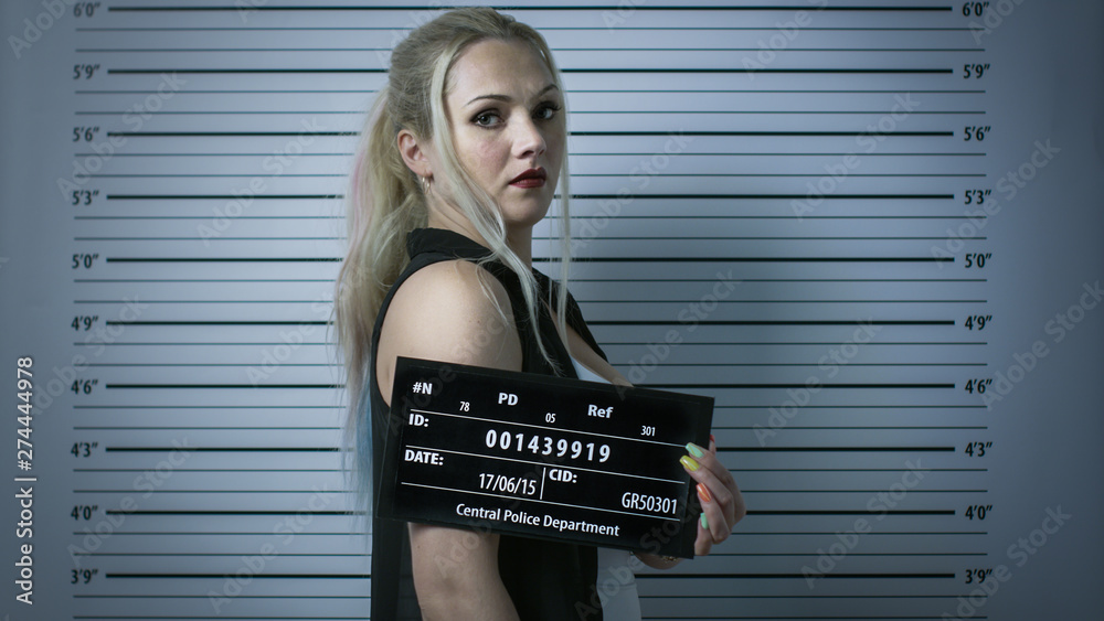 In a Police Station Arrested Woman Gets Side-View Mug Shot. She Wears ...