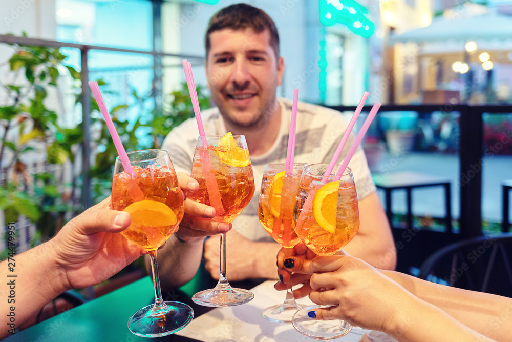 Friends toasting with cocktails at restaurant Stock Photo | Adobe Stock