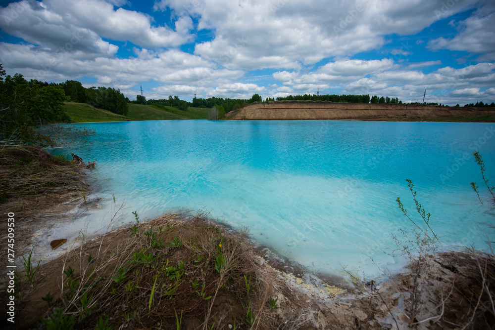 Alkaline solution. Ash dump dumping waste into the water. Ecological ...