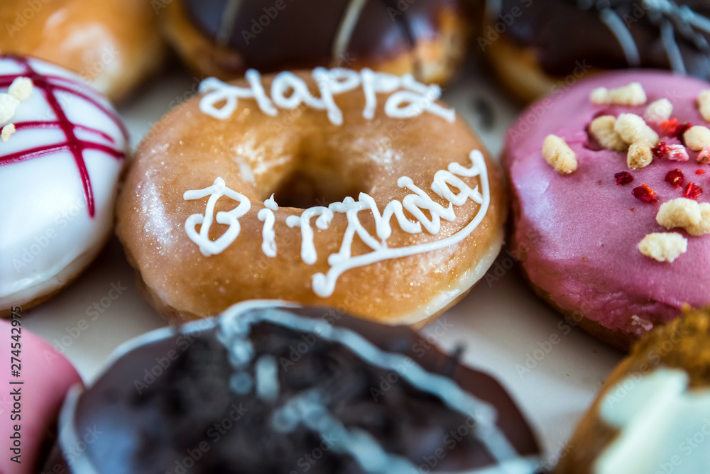 happy birthday multicoloured donuts inside white box Stock Photo ...