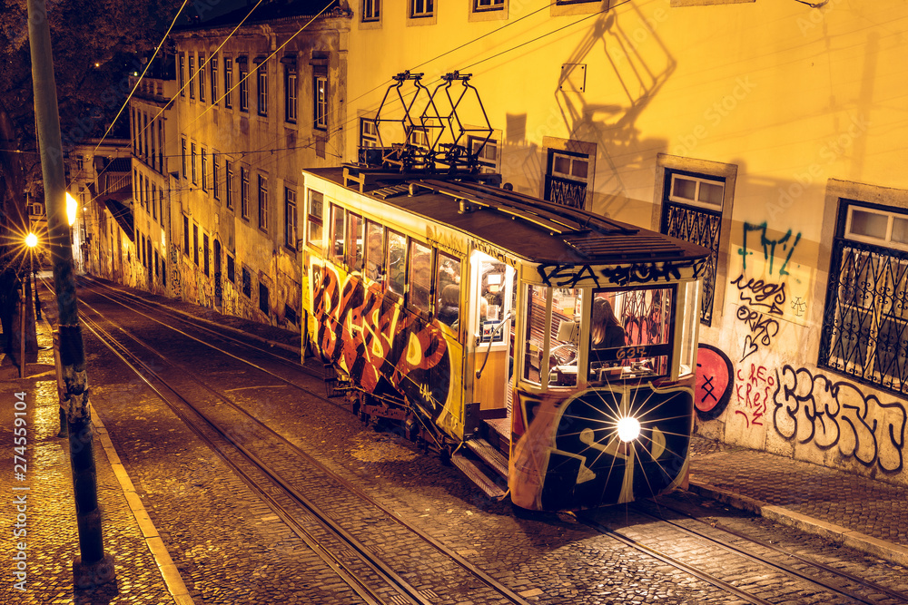 Stop of a cable car in the capital of Portugal. Stop illuminated with ...