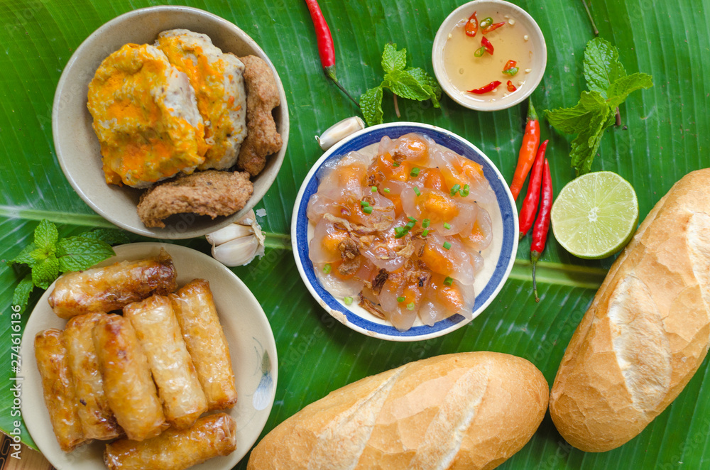Vietnamese food background with spring roll, banh mi, banh canh ...