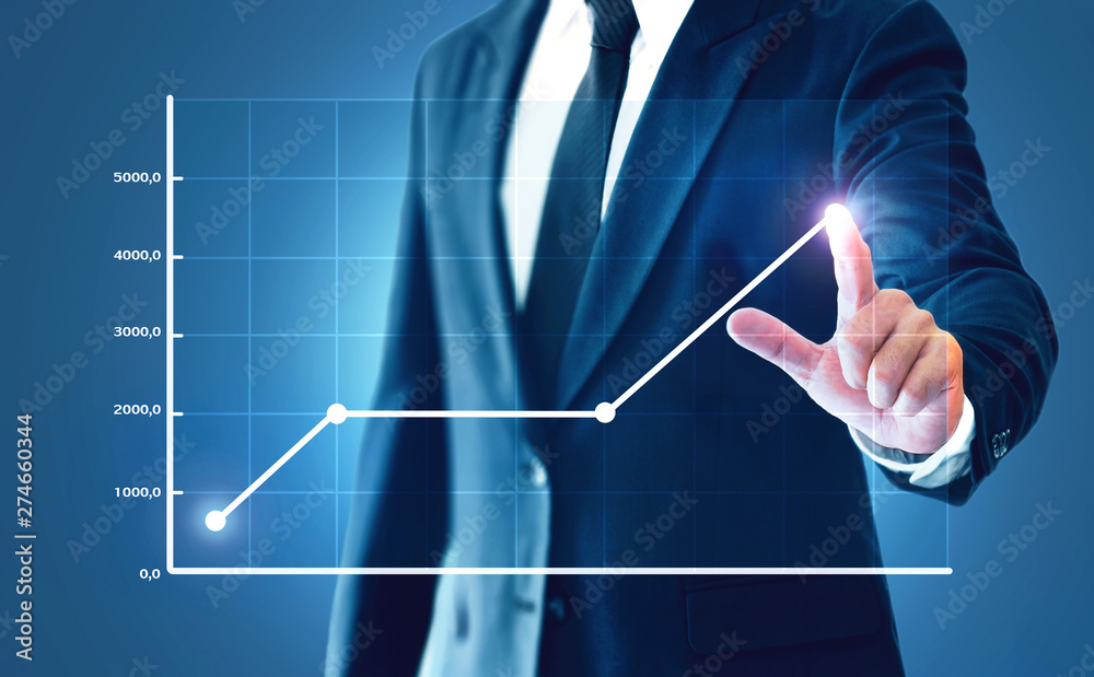 Businessman showing business growth on a chart, hands touch the graph ...