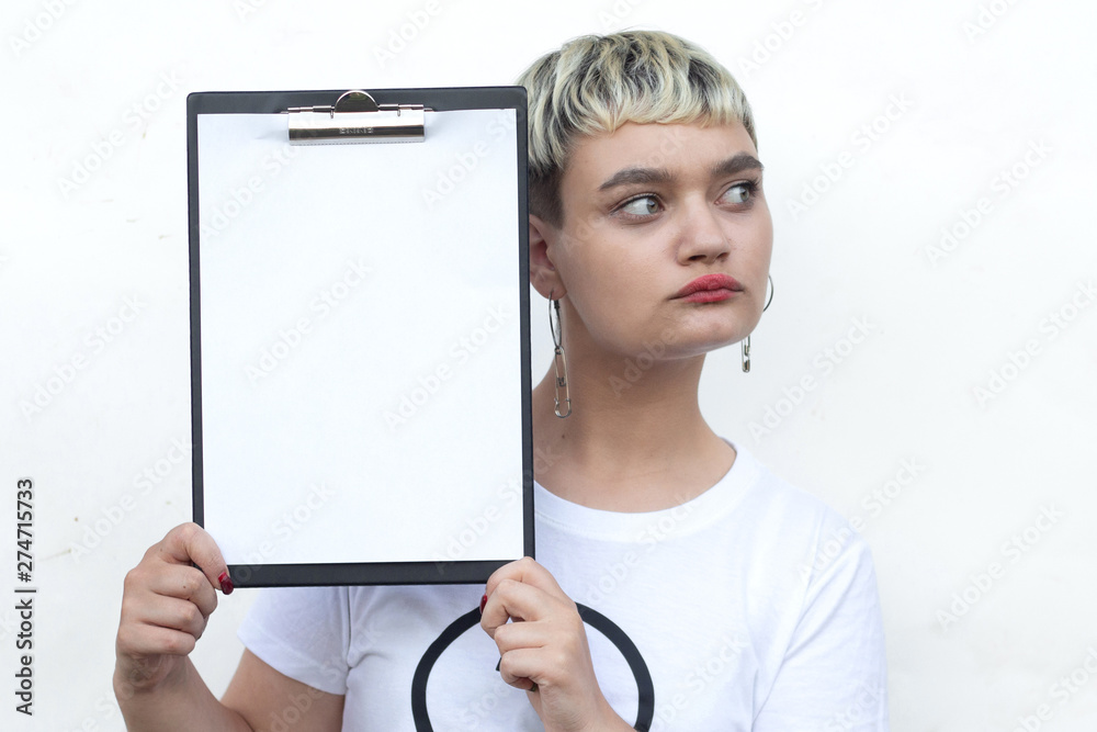 Young blonde girl showing blank white big A4 paper. Leaflet ...