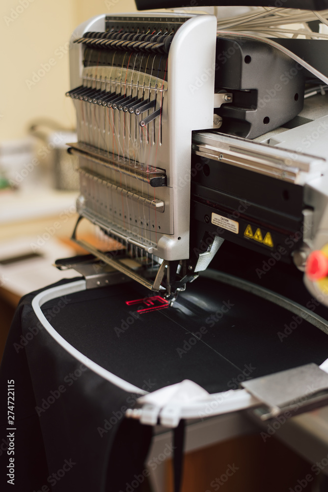 embroidering text on a sewing machine on an industrial scale. machine ...