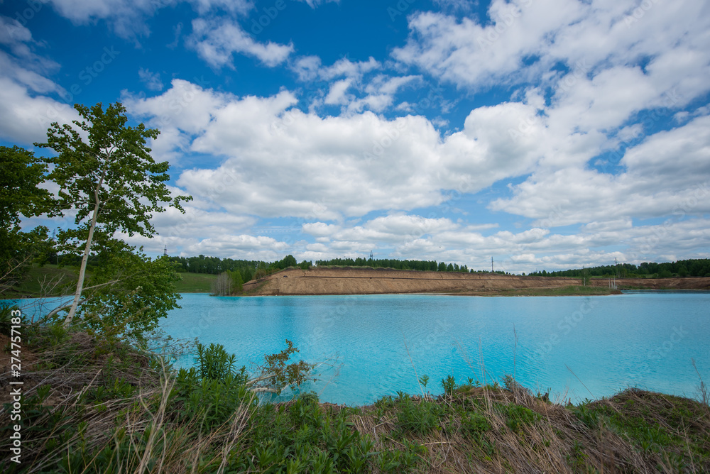 Alkaline solution. Ash dump dumping waste into the water. Ecological ...