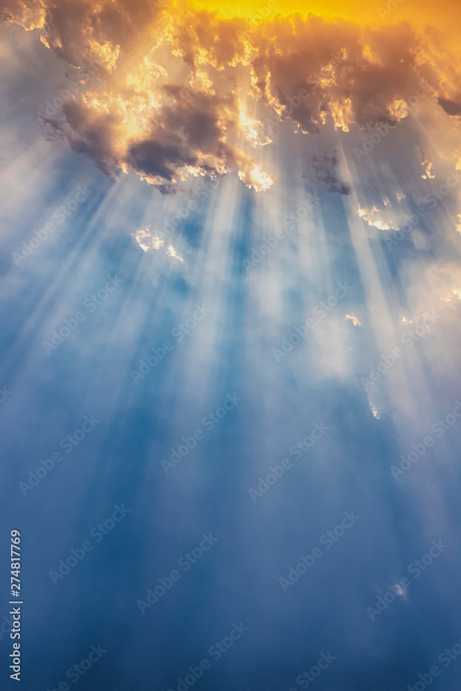 Besutiful ray of sunlight breaking through clouds at sunset. Stock ...