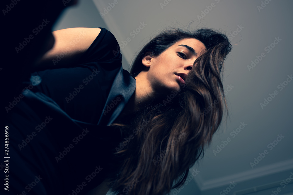 Low angle portrait of a beautiful serious woman Stock Photo | Adobe Stock