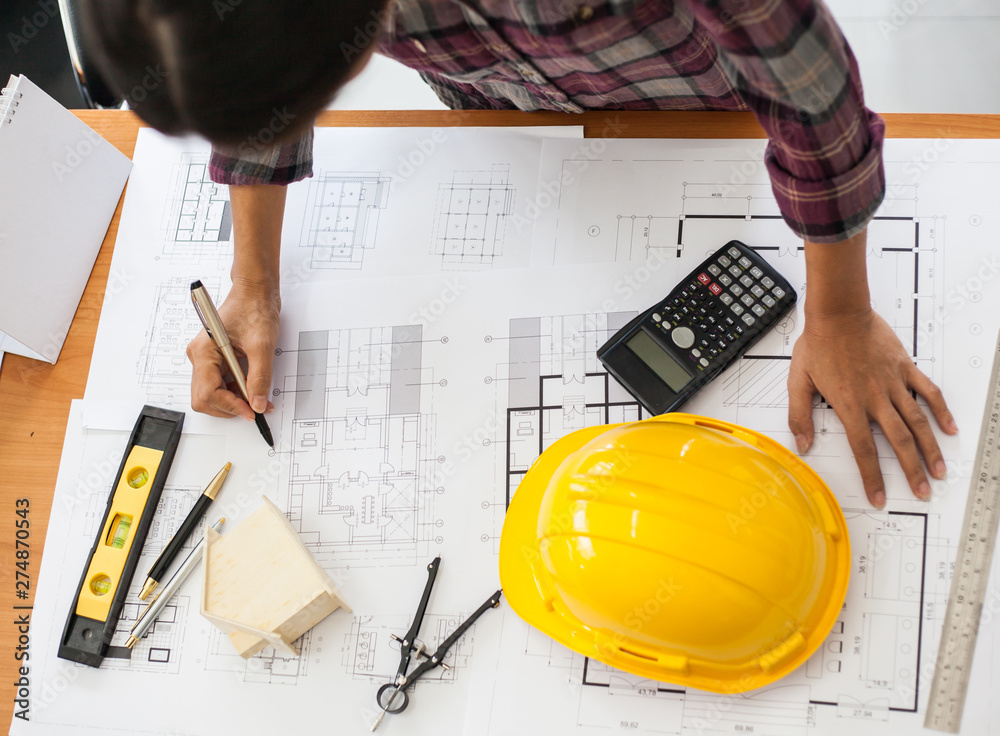 Construction and building concept. Engineers or architect holding a pen ...