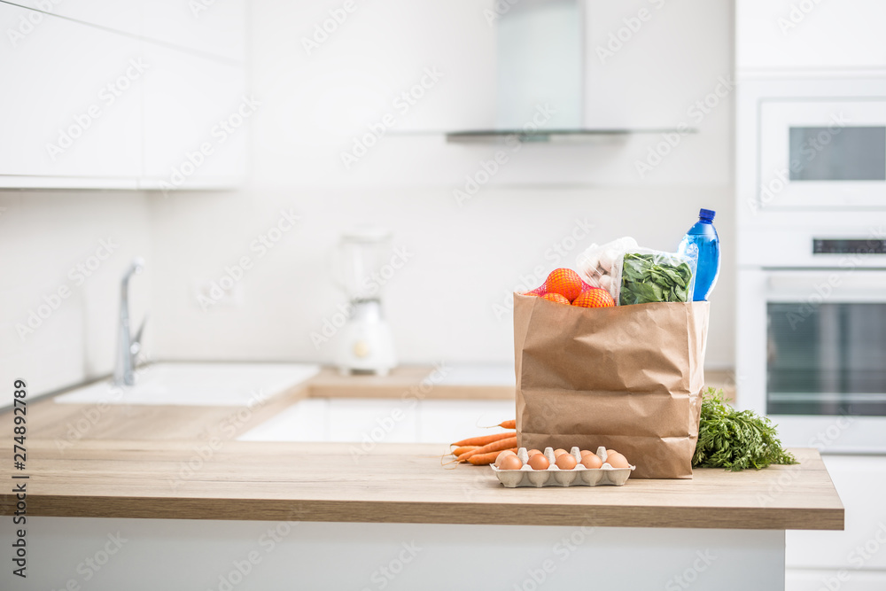 Paper bag with purchase on home kitchen Stock Photo | Adobe Stock