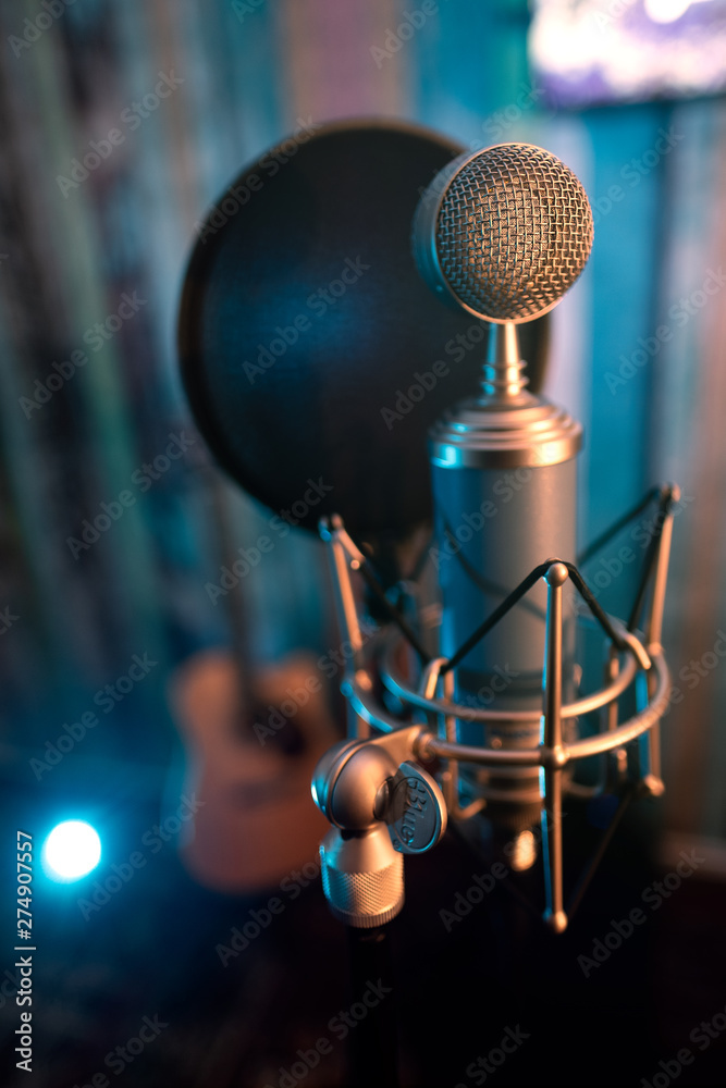 Studio recording microphone on a blur wood background voice karaoke ...
