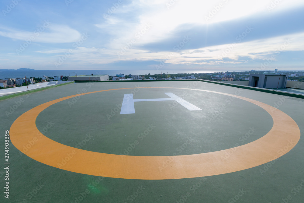 Symbols for helicopter parking on the roof of an office building. Empty ...