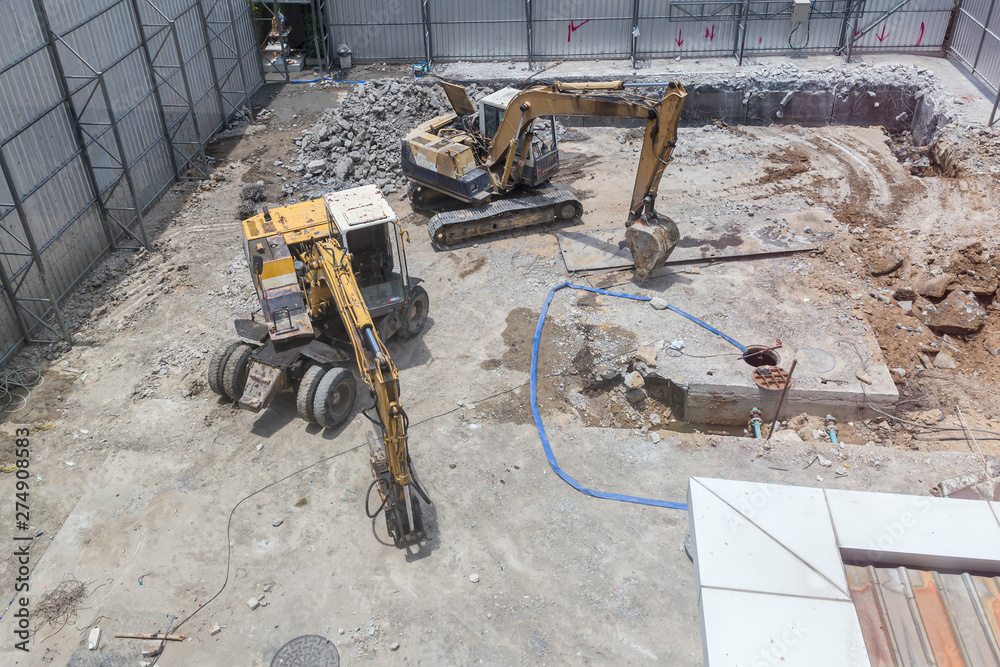 Building Machines: Digger loading trucks with soil. Excavator loading ...