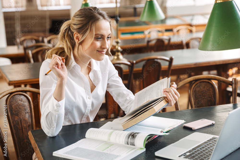 Pretty young smart girl student studying Stock Photo | Adobe Stock
