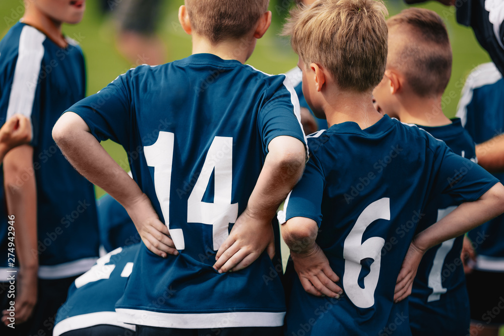 Children in soccer team. Young boys standing in a team with coach ...