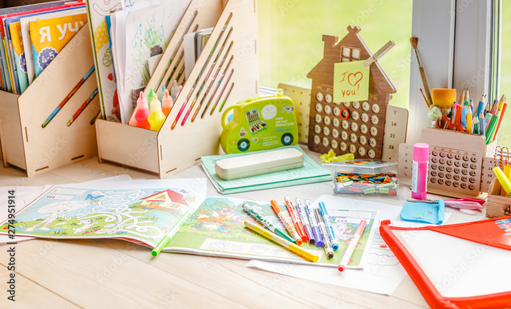 Children's wooden table by the window - a workplace for creativity and ...