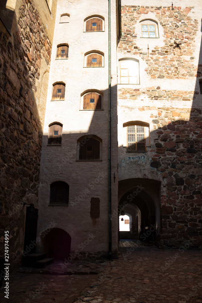 Authentic medieval courtyard and stone walls of the historic medieval ...