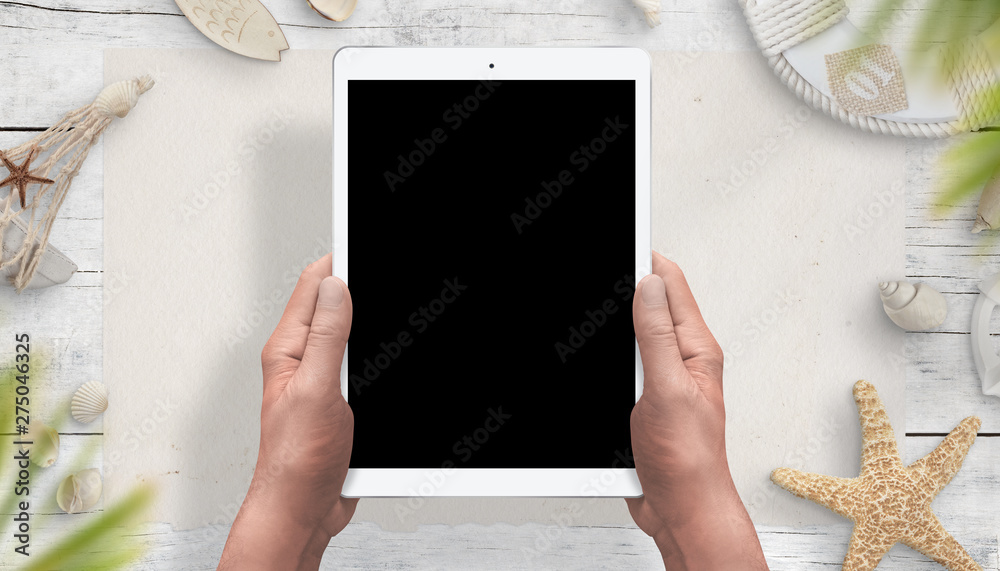 Tablet mockup in hands for travel app or web design presentation. Sea ...