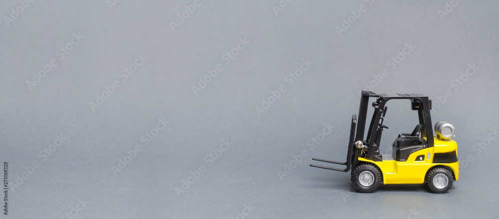 Yellow forklift truck side view on gray background. Warehouse equipment ...