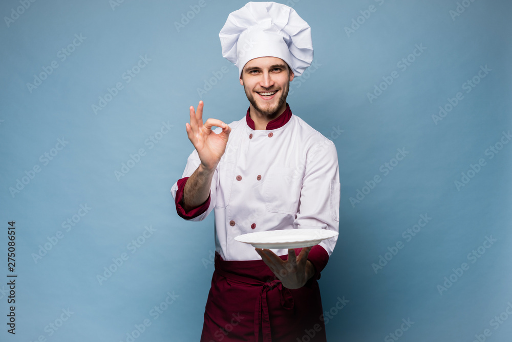 Positive professional happy man chef showing tasty ok sign isolated on ...