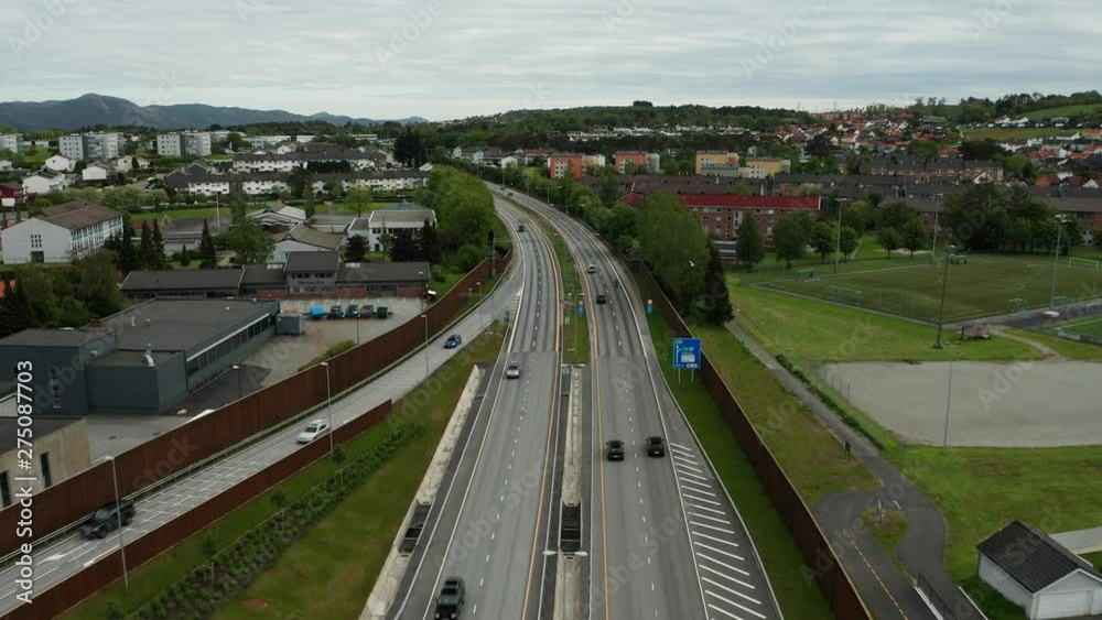 Cinematic Aerial of E39 Highway With Cars and Residental Houses in ...
