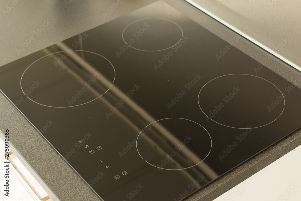 Stove with induction cooktop. Modern black induction cooker on black ...