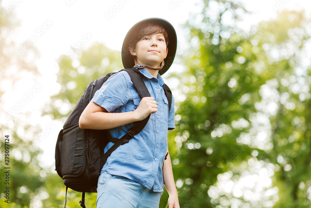 Portrait of little explorer in forest. Boy traveler in helmet play in ...