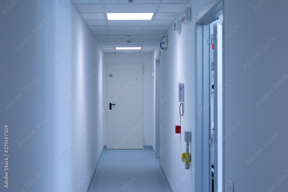 A clean and white corridor is seen inside a science laboratory with ...