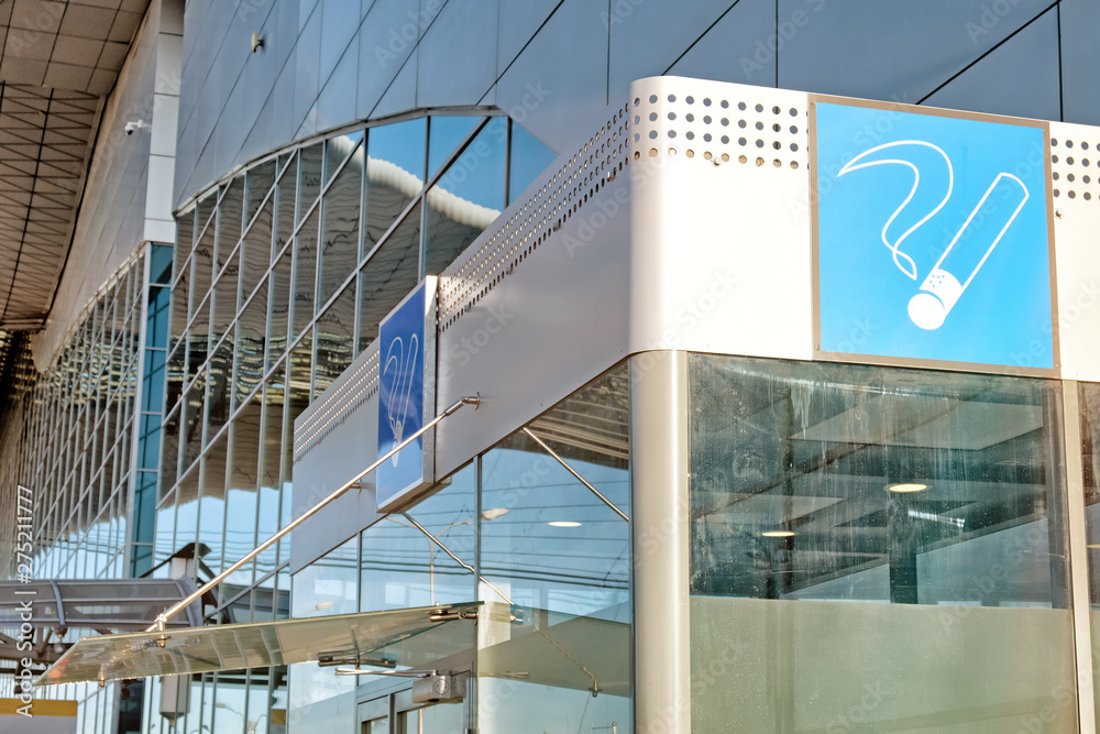 outdoor smoking area at airport terminal closeup side view of smoking ...