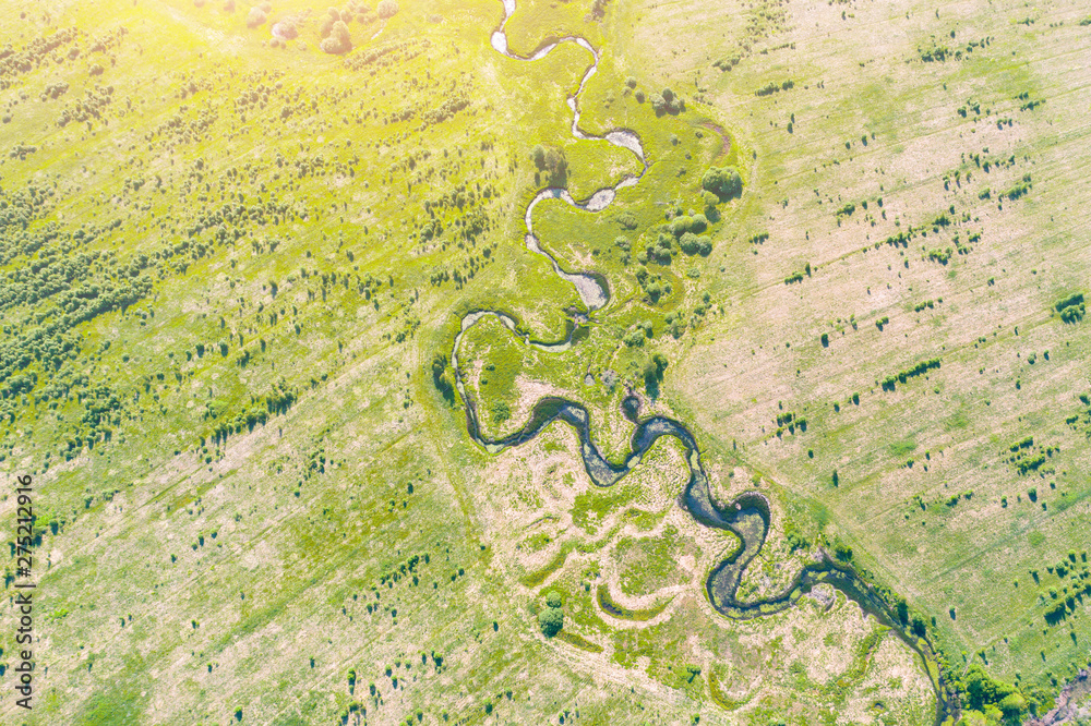 Aerial landscape countryside of winding small river, stream in green ...