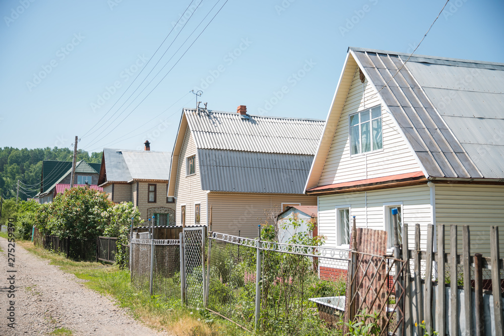 radio antenna on the house. chimney on the roof against the blue sky ...