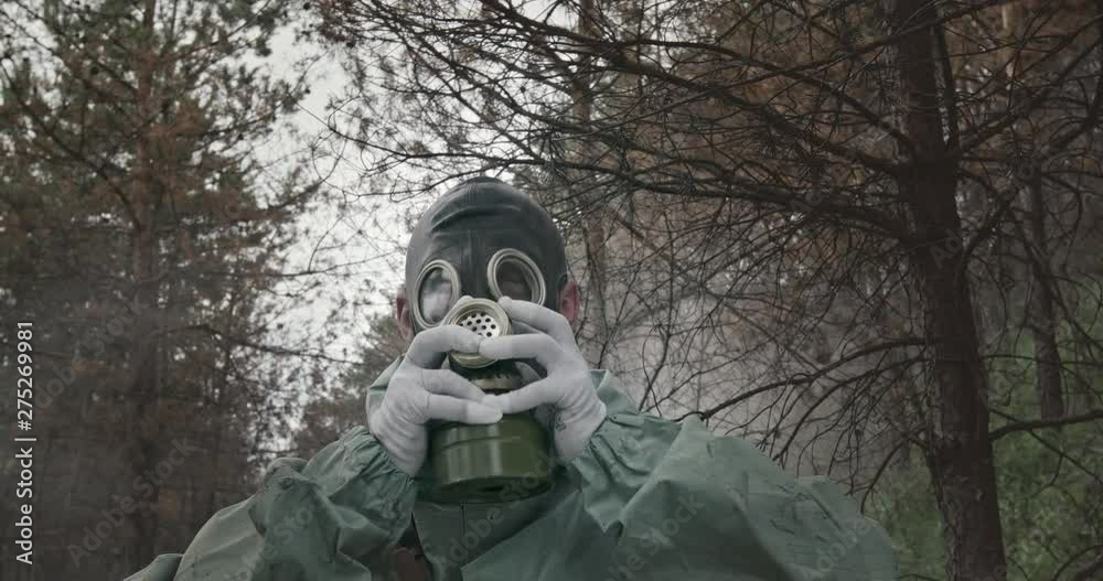 Portrait of a Chornobyl cleaner of a dosimeter, a gas mask in a ...
