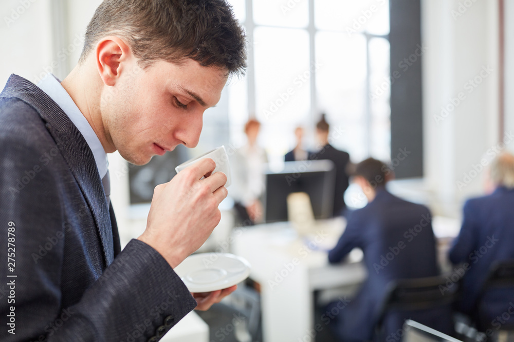 Student drinks cup of coffee Stock Photo | Adobe Stock