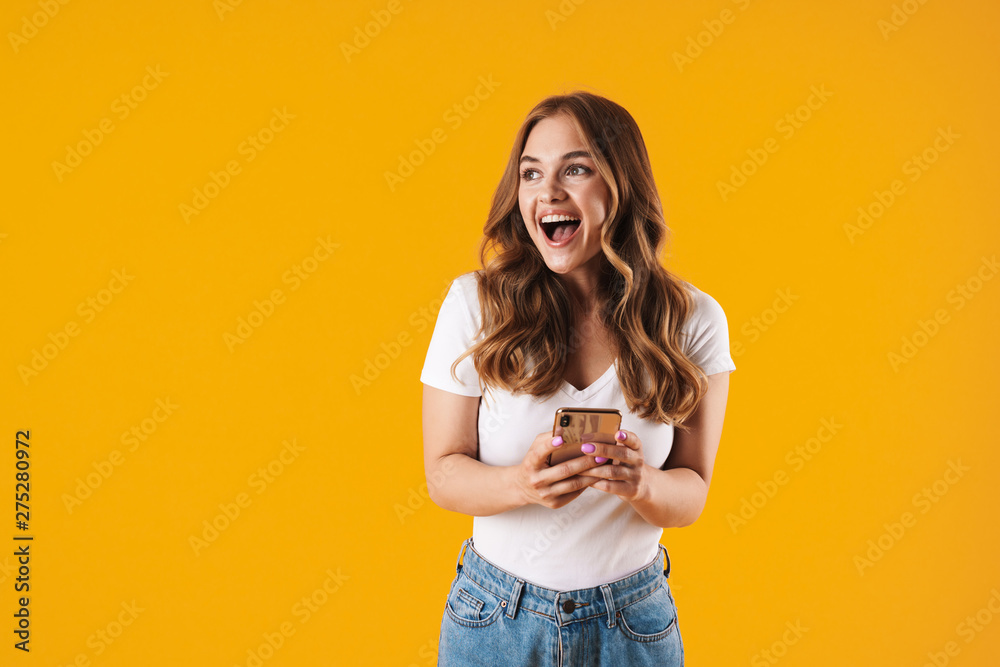 Foto de Excited young girl wearing casual clothes standing do Stock ...