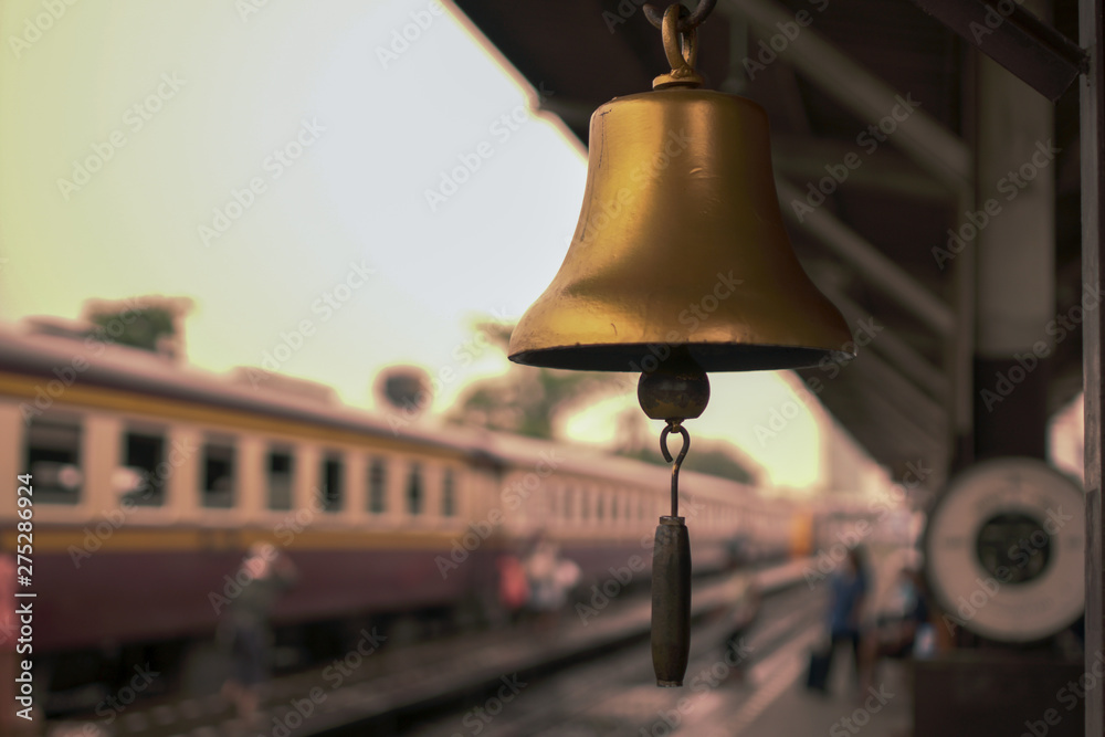 Gold Train station bell local in thailand with vintage train background ...