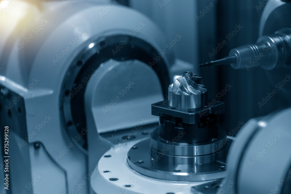 The 5 axis CNC milling machine cutting the turbine blade parts with ...
