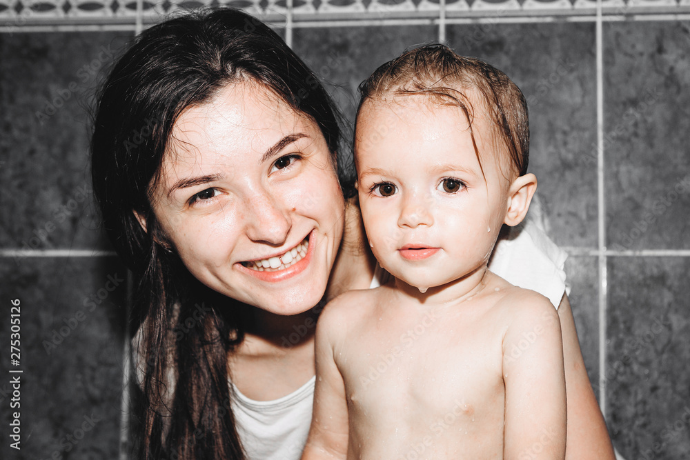 the average family is washing and bathing the baby in the bathroom, the ...