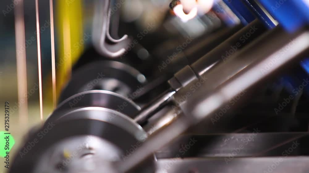 Wire reinforcement of modern tires in a factory. Steel wire coils at a ...