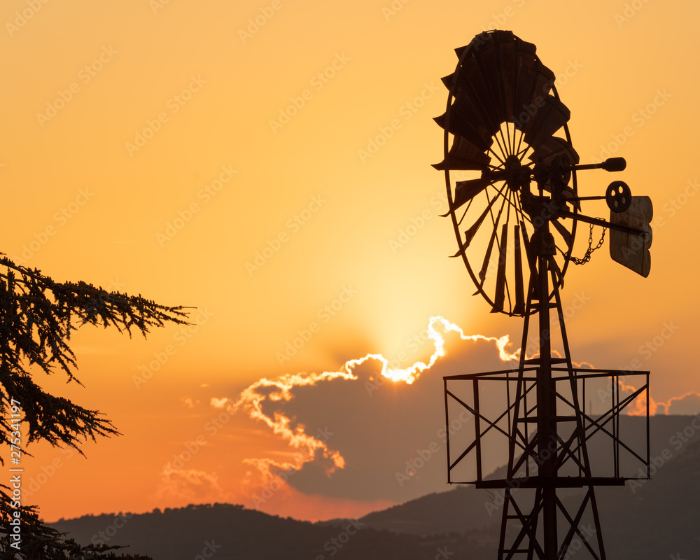 Windrad vor Sonnenuntergang Stock Photo | Adobe Stock
