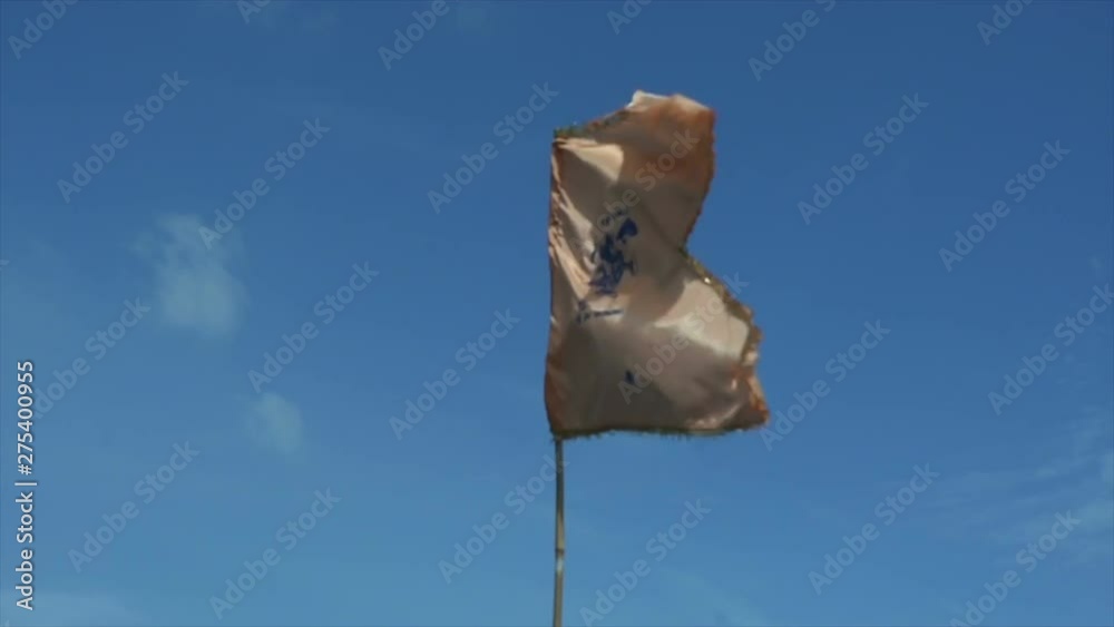 A flag with Hindu god Hanuman on it, flying in the air, Hampi ...